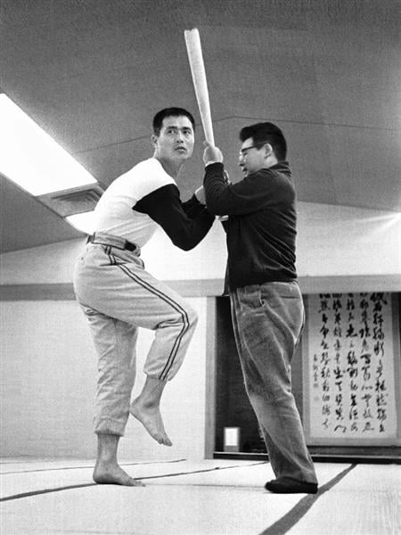 Hiroshi Arakawa tweaks Sadaharu Oh's stance, c. 1964 - 9GAG