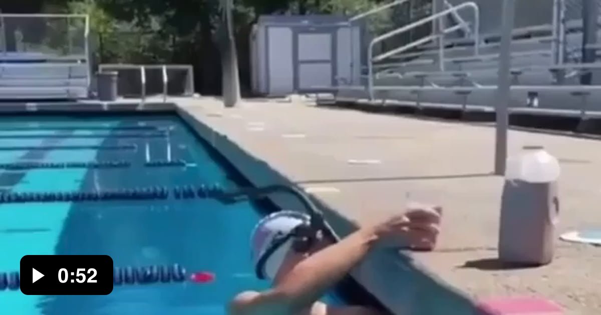 Olympic Gold medalist, Katie Ledecky, swims the length of a pool with a ...