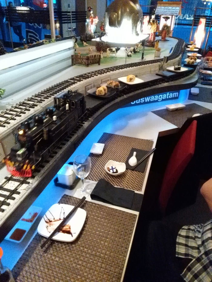 This sushi restaurant in Brussels delivers your food by mini-train - 9GAG
