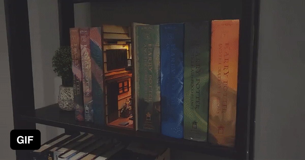 This bookshelf insert that looks like a little town between books - 9GAG