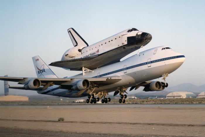 A 747 carrying Space Shuttle Endeavor. Kinda cute. - 9GAG