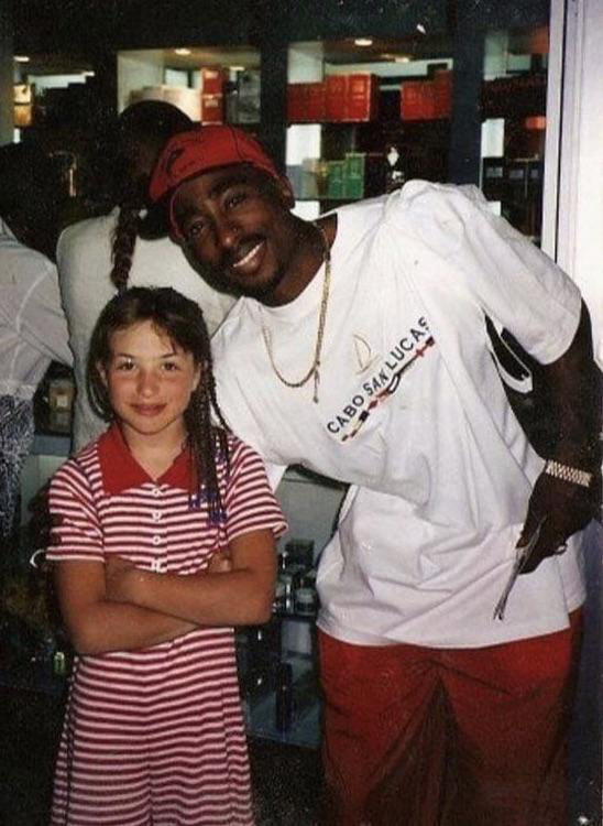 2Pac takes a photo with a young fan in Mexico, 1996 - 9GAG