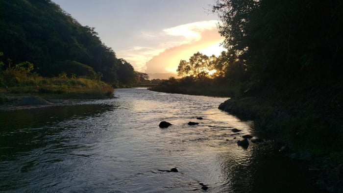 Keeping the landscapes going. River in Honduras at dusk. Deep in the ...