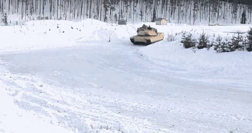 An M1 Abrams - a 62 ton tank, drifting in the snow - 9GAG