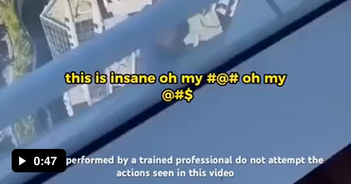 Random bloke climbs up skyscraper and passes a office while people ...