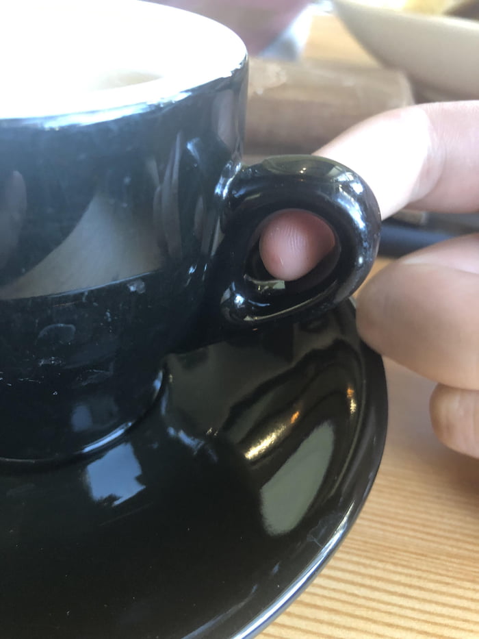 This coffee mug hole isn’t even big enough for one finger. - 9GAG