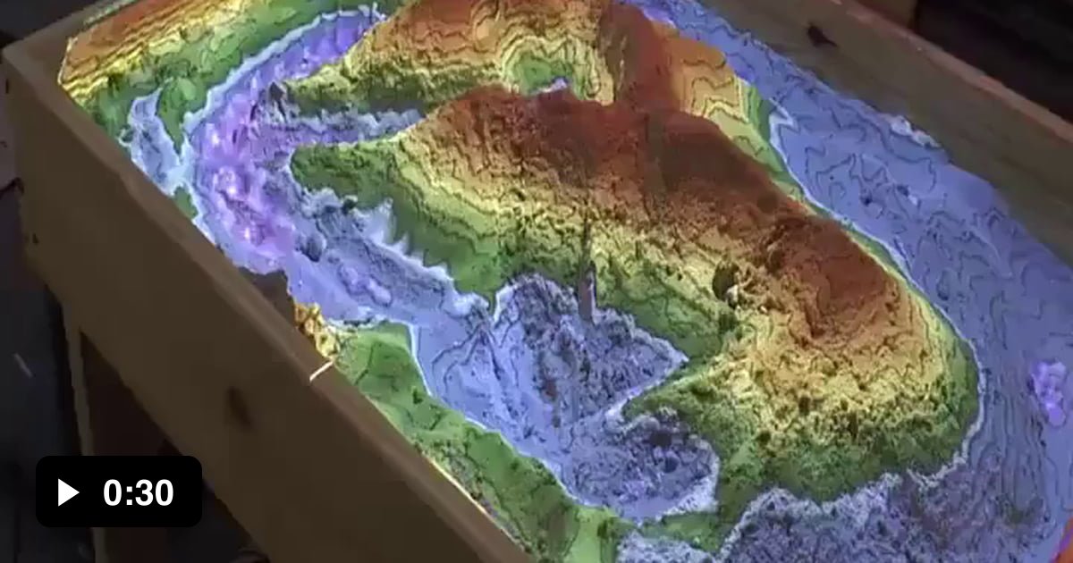 An Augmented Reality Sandbox allows students and the public to interact ...