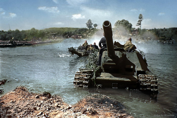 Heavy tanks of Soviet troops advance west along the forest roads of ...