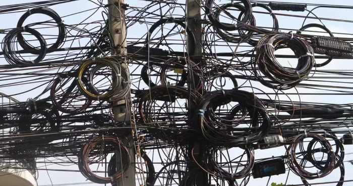 Bangkoks “Sky Spaghetti”. A combination of telephone, electric and cable wires all sharing the ...