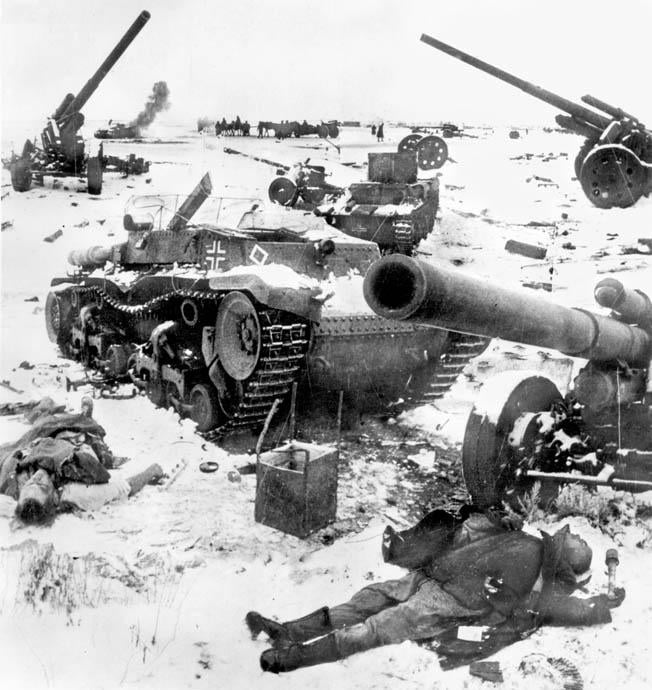 A graveyard of German, tanks, guns, and personnel litter a snowy ...