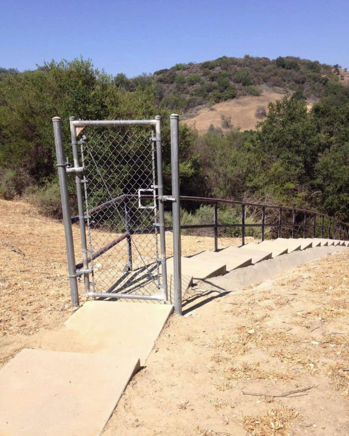 This gate's meant to keep folks off the stairs but is super easy to get ...