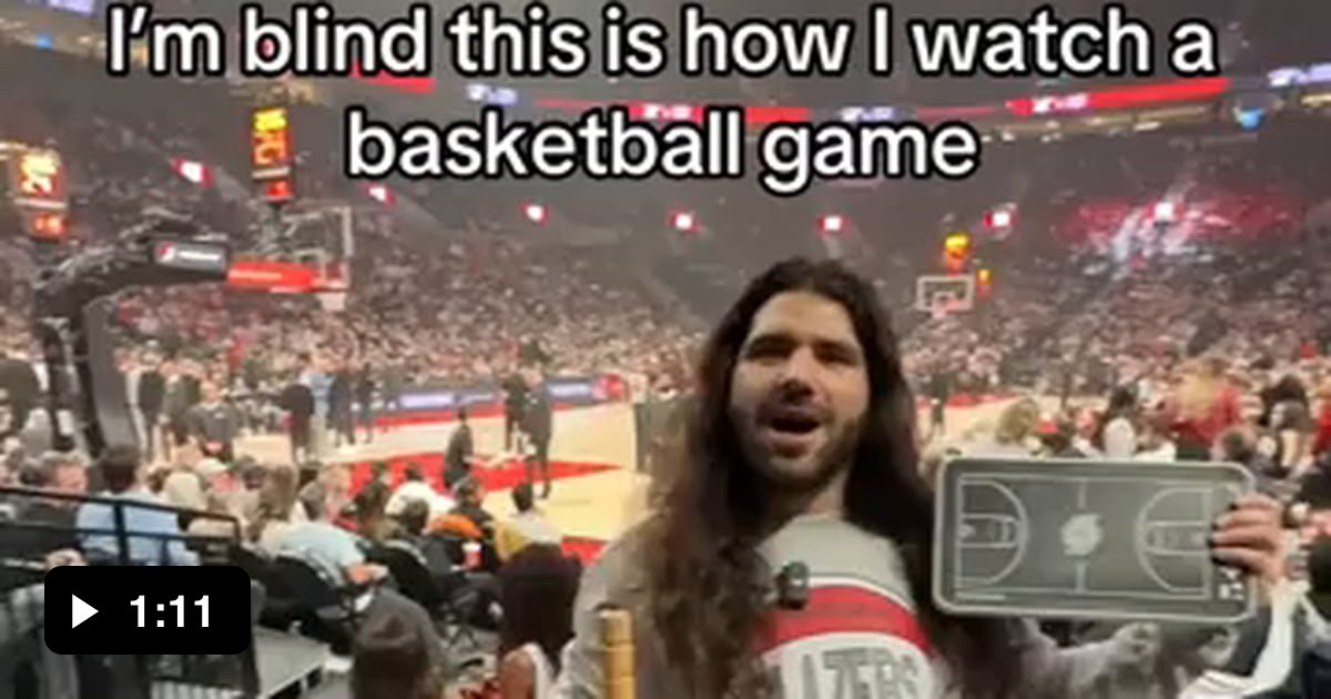Blind man shows device that helps him watch a basketball game. The Portland Trail Blazers are ...