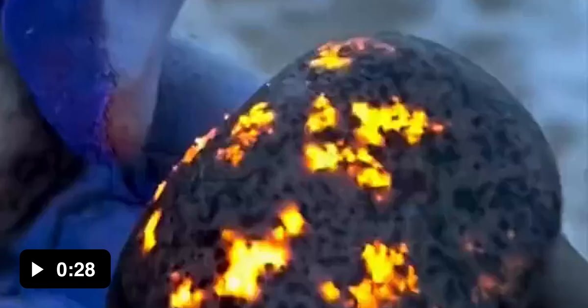 Syenite rocks with sodalite fluorescing orange when exposed to UV light ...