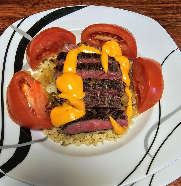 Grilled Ribeye Steak served with Seasoned Brown Rice, Sautéed ...