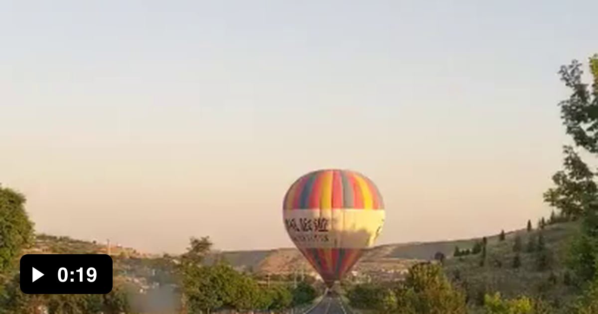 Hot air balloon in the middle of the road looks like a reenactment of ...