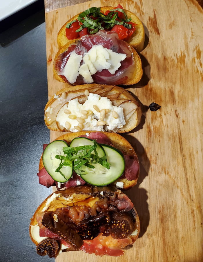 Assorted bruschetta. Roasted garlic, confit tomato and basil; mushroom ...