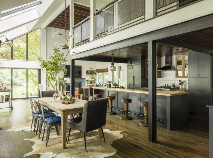 Kitchen under a mezzanine floor in the industrial open plan living ...