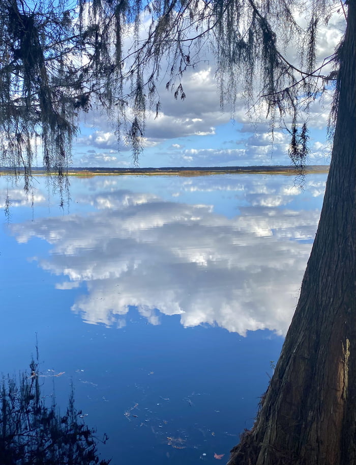 Nature's mirror showing off the fluffy clouds. - 9GAG