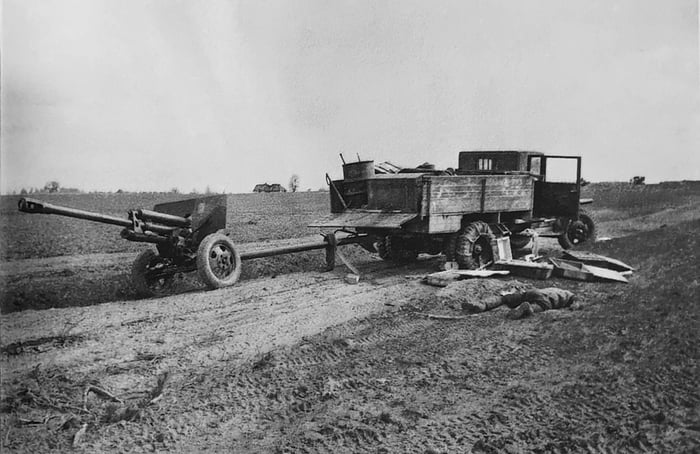 Soviet GAZ AA truck towing a ZiS-3 AT gun shot up by a German tank near ...