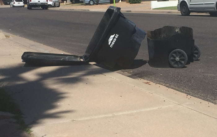 Garbage bin cut in half by collection truck - 9GAG