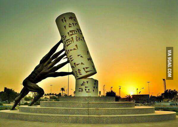 The statue of saving iraq, a rock with Cuneiform writings symboling an ...