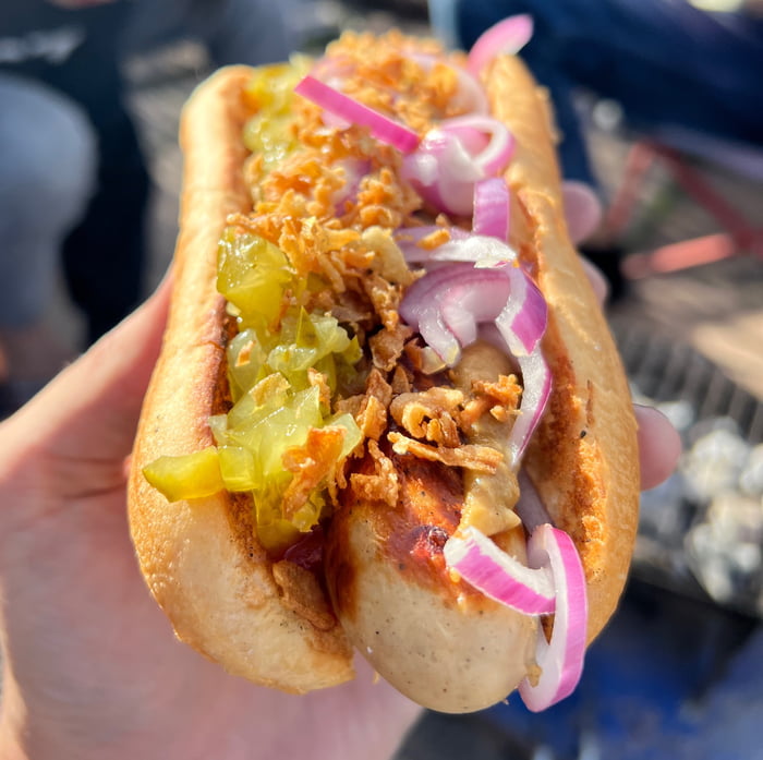 Grilled German Bockwurst in toasted bun, topped with sweet pickles ...