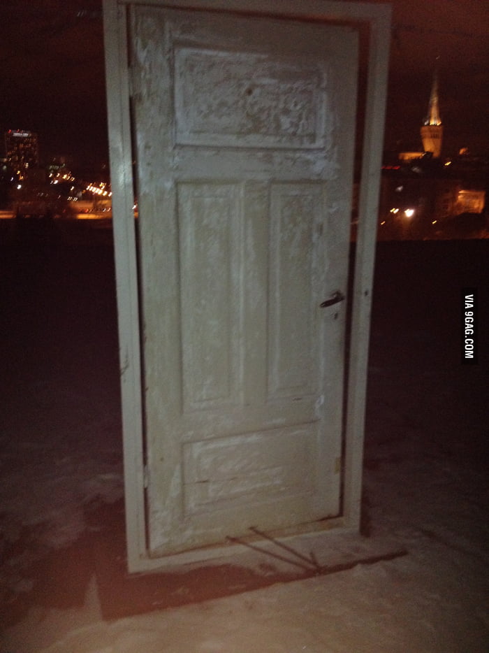 Random door steel wired to the top of the town hall in Estonia, Tallinn ...