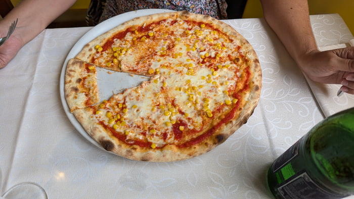 Went to Italy with my wife and she started eating her pizza like this ...