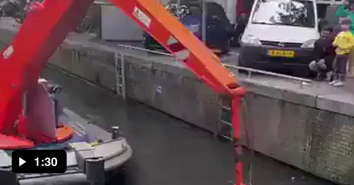 Draught crane vessel removing bicycles out of the canals of Amsterdam ...