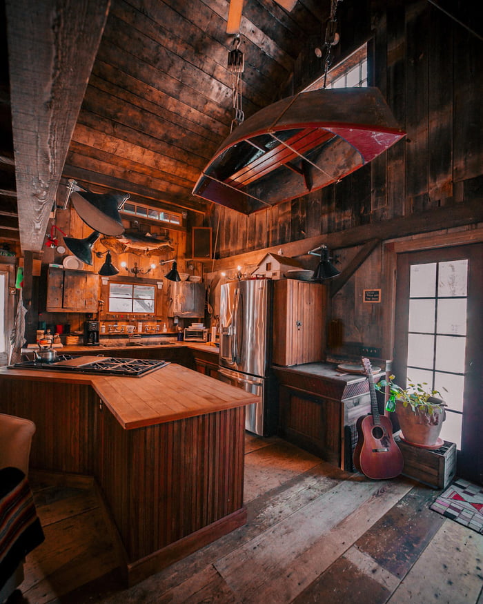 Rustic Cabin Kitchen with a Boat Hanging from the Ceiling - 9GAG