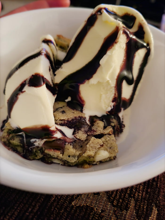 Warm cookie clash blondie topped with vanilla ice cream - 9GAG