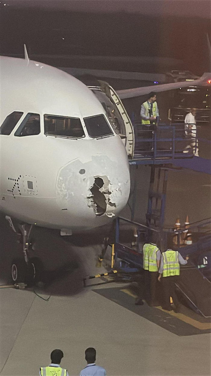Nose of a flight after it flies through a hail storm. - 9GAG