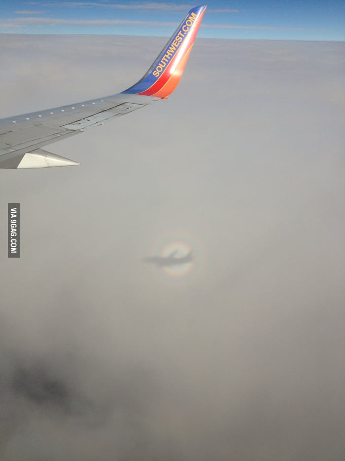 Plane's shadow on a cloud in a rainbow - 9GAG