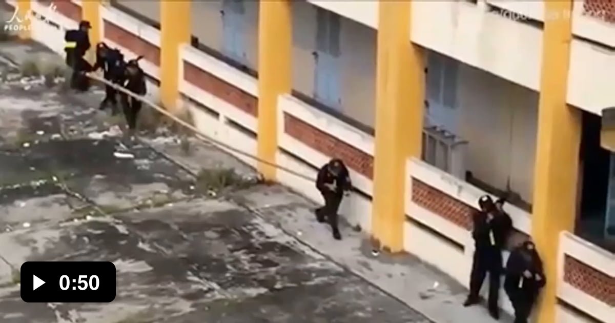 Vietnamese Police Raiding a Building - 9GAG