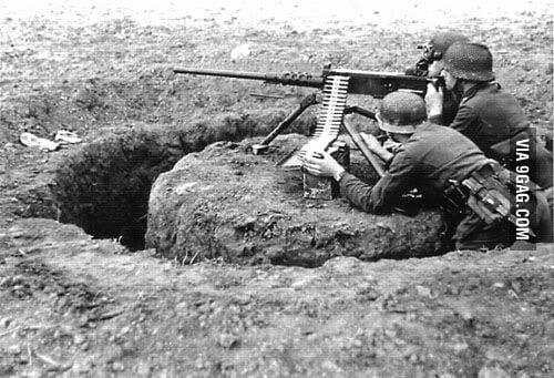 A captured 50 caliber browning machine gun tested by German soldiers ...
