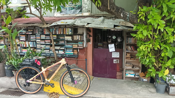 A curbside library and a bamboo mountain bike - Makati City ...