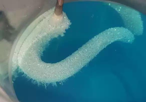 The blue liquid here is silver nitrate. When copper is introduced ...