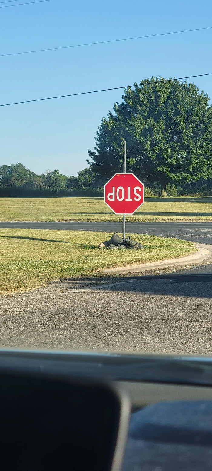 Someone must have been too short to hang this Stop Sign at the normal ...