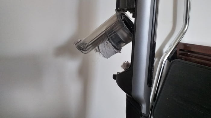 The dust container on this vacuum cleaner opens downwards and is spring ...