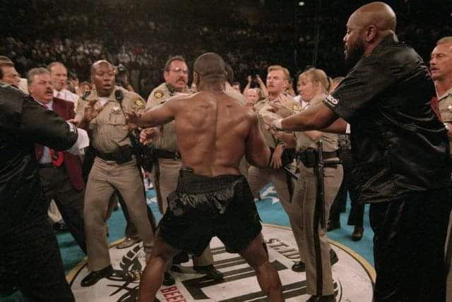 Arresting Mike Tyson after he took a bite from the ear of Hollyfield - 9GAG