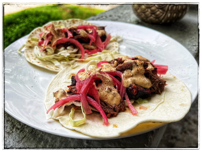 Smoked beef rib tacos with pickled onion, shredded cabbage, and ...