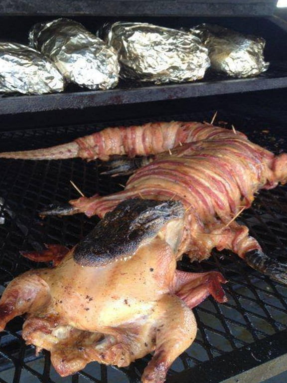 Crocodile wrapped in bacon with a chicken in its mouth - 9GAG
