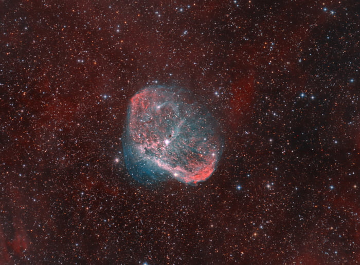 The Crescent Nebula, a super massive star ejecting his outer layers ...