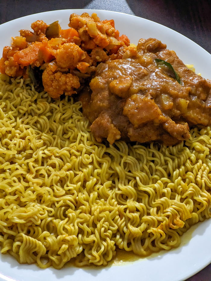 Meat and potatoes (right) and spicy mixed veg (left) on a bed of Indian ...