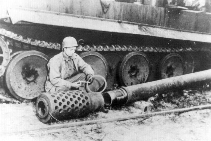 American soldier inspecting muzzle brake of the german 12.8cm pak 44 ...