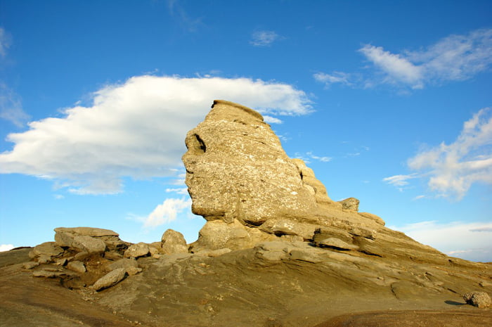 The stone with humanoid shape. Situated in Romania, also known as "The ...