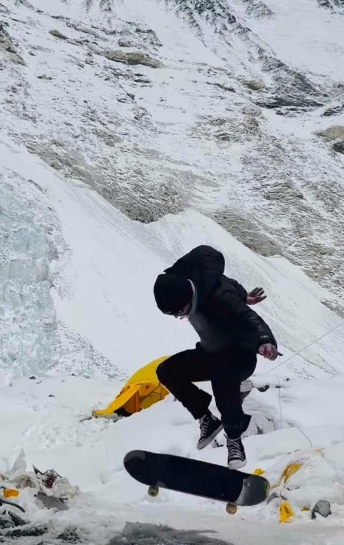 Pro wrester Darby Allin doing a kickflip on Mount Everest. - 9GAG