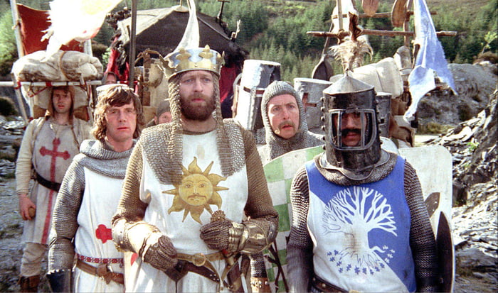 Monty Python (1975) - Bones of full fifty men lie strewn about its lair ...