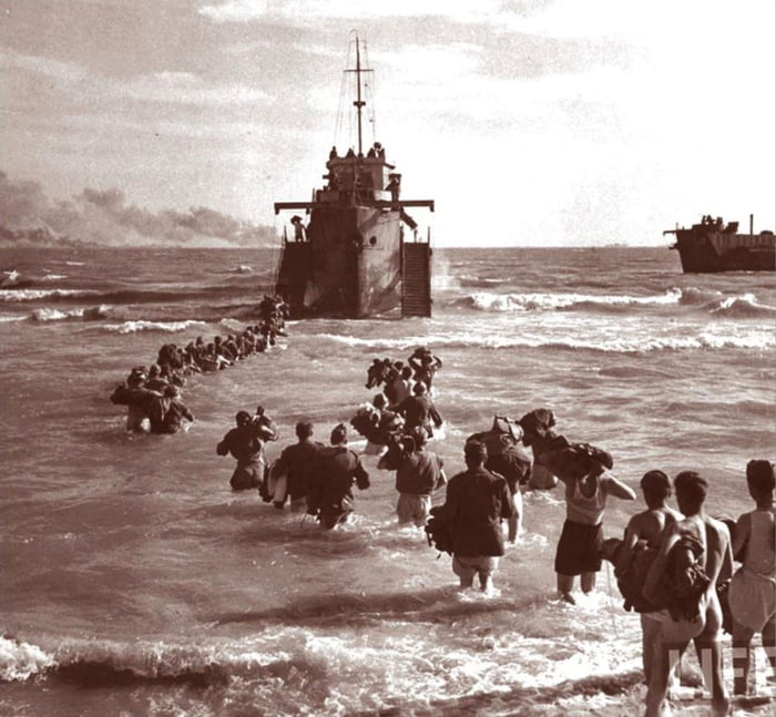 Italian soldiers captured in the battle of Gela board a landing ship ...