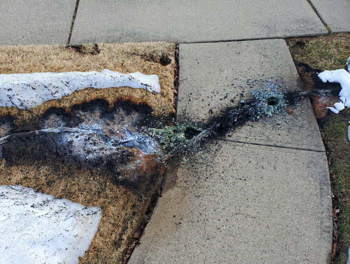 Live powerline fell, it was so hot that it melted through the sidewalk ...